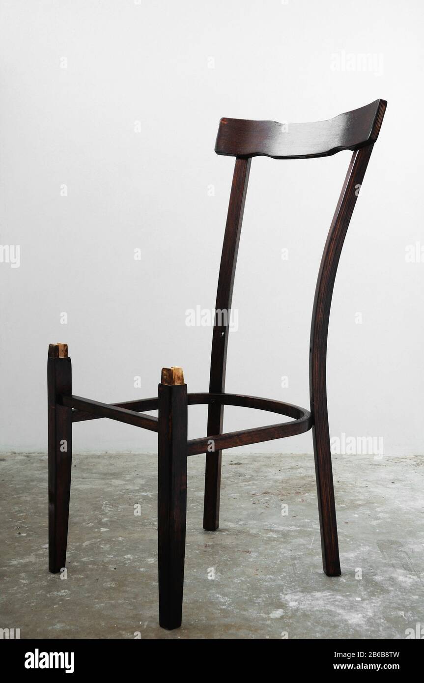 The framework of an old wooden chair after cleaning and a covering is ...
