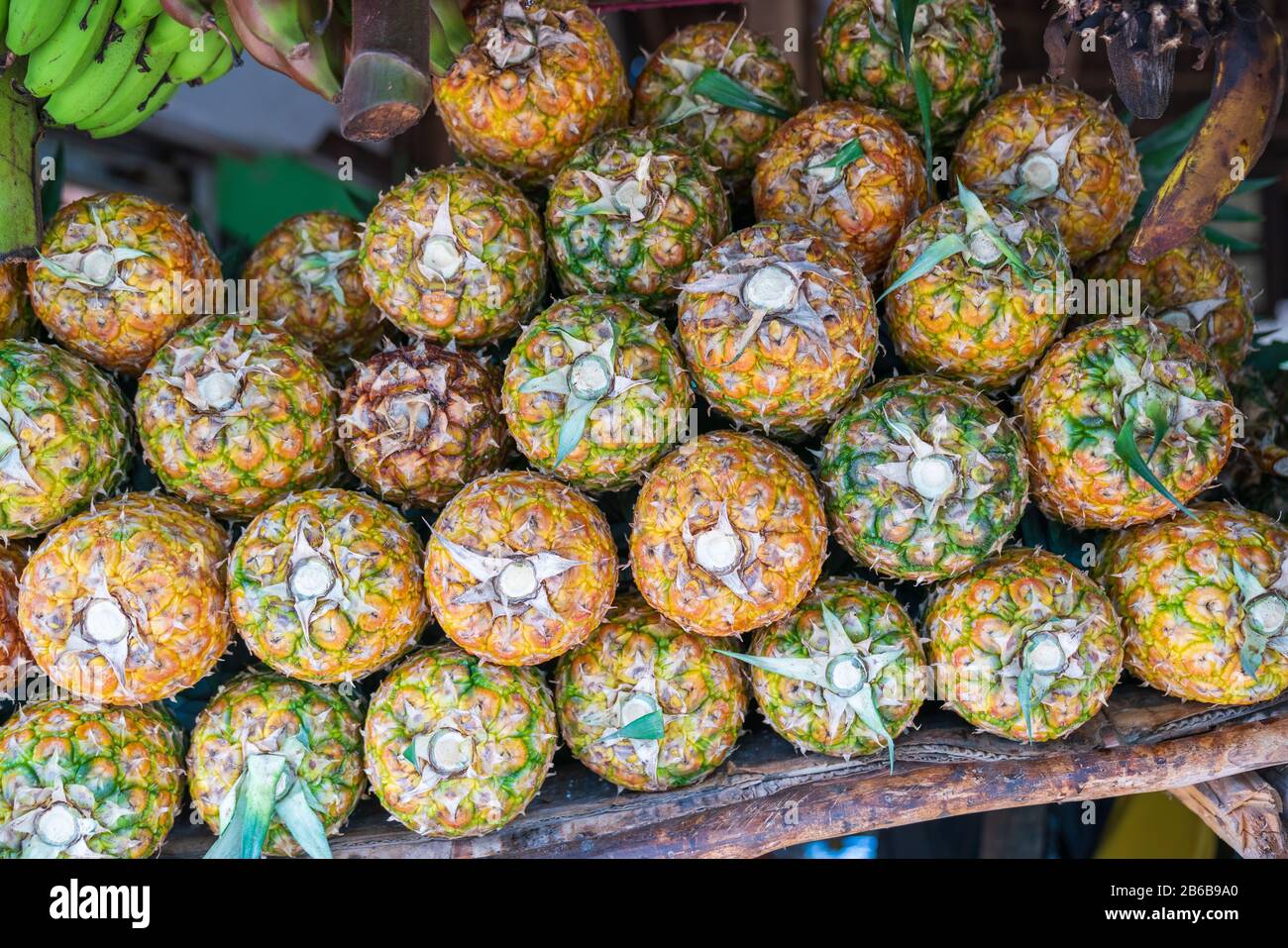 Pineapple stack at grocery on tropical marketplace outdoor,Samana ...