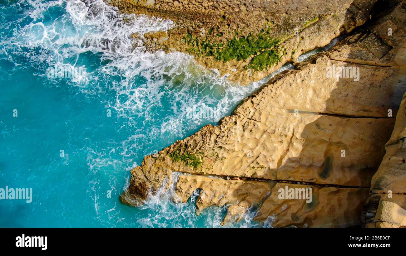 Wild Ocean water from above - Waves hitting the rocks Stock Photo - Alamy