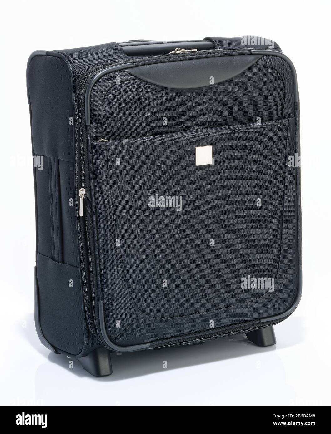 A black suitcase with two wheels and a pulling handle Stock Photo - Alamy