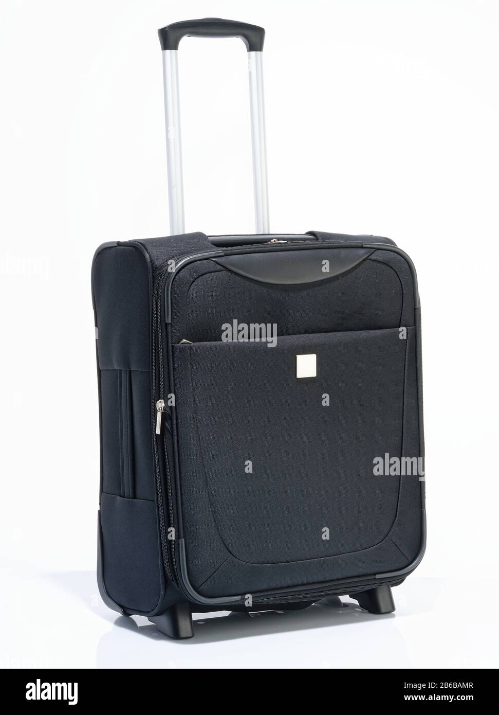 A black suitcase with two wheels and a pulling handle Stock Photo - Alamy