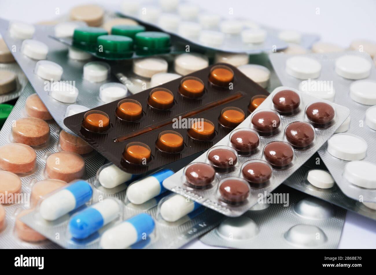 Heap of medical tablets isolated on a white background Stock Photo - Alamy