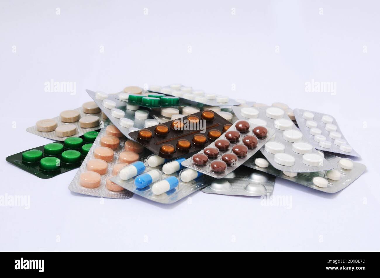 Heap of medical tablets isolated on a white background Stock Photo - Alamy