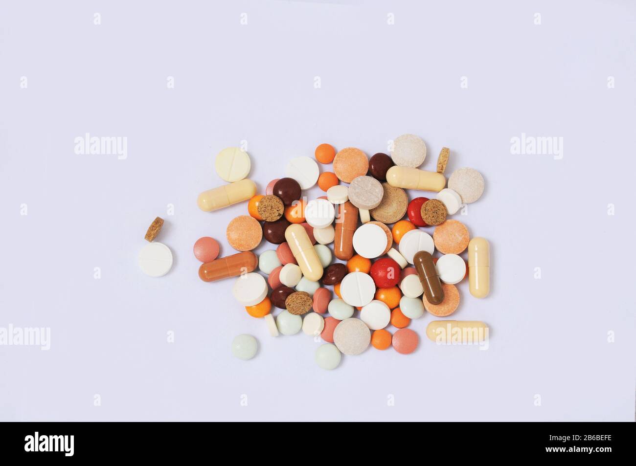 Heap of medical tablets isolated on a white background Stock Photo - Alamy