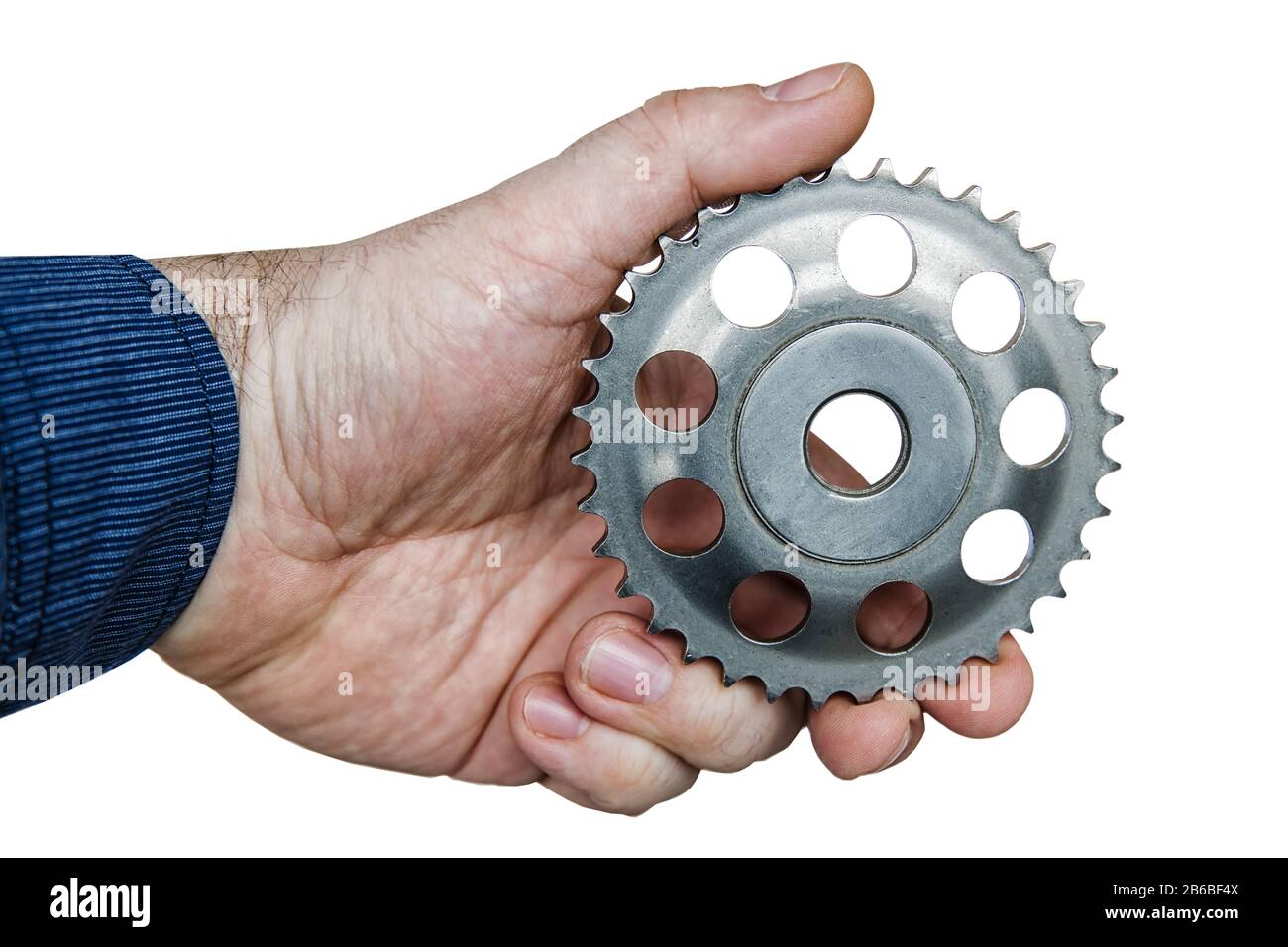 man hand holding a metal gear with holes on a white background Stock ...