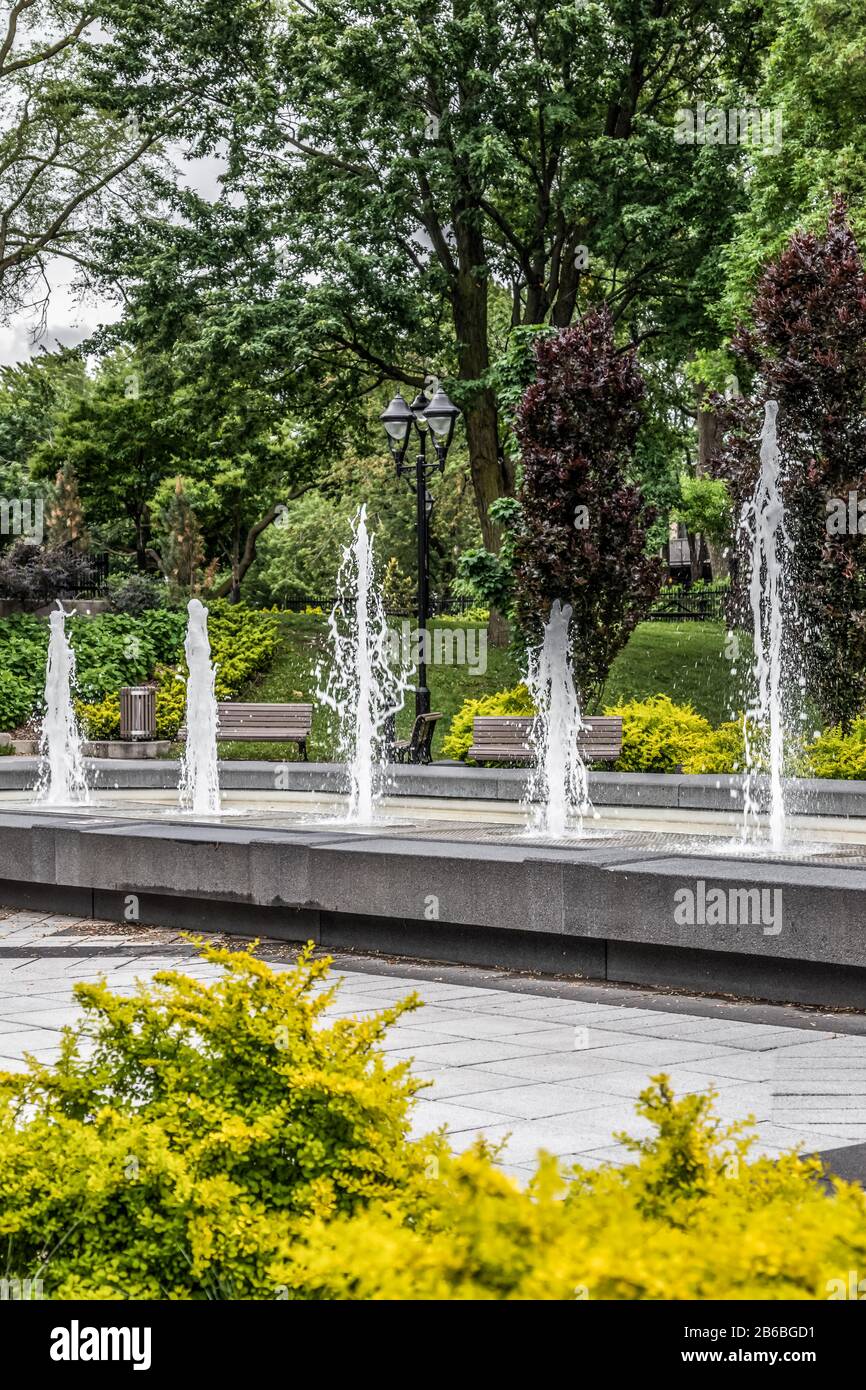 Spring city park with fountains and green trees. Montreal (Quebec ...