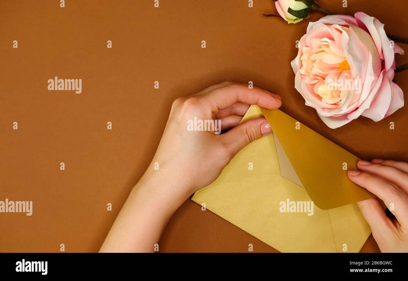 Envelope in hand Stock Photo - Alamy
