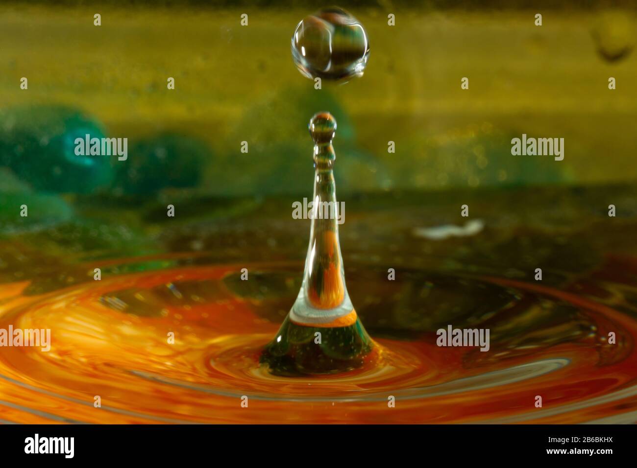 drops bouncing in the water Stock Photo - Alamy