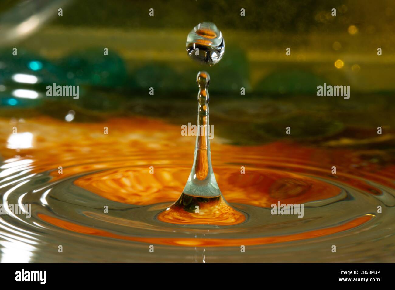 drops bouncing in the water Stock Photo - Alamy