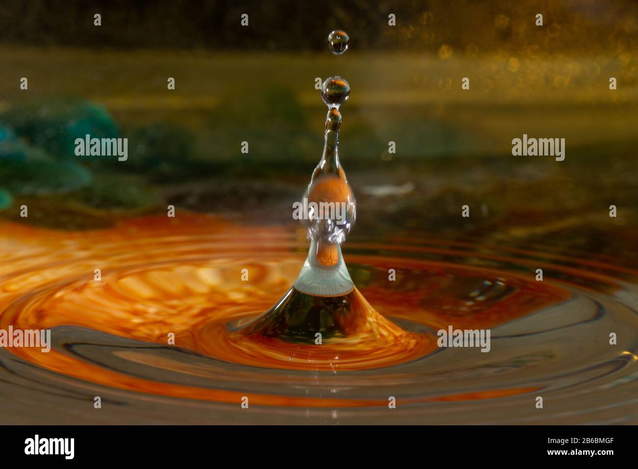 drops bouncing in the water Stock Photo - Alamy