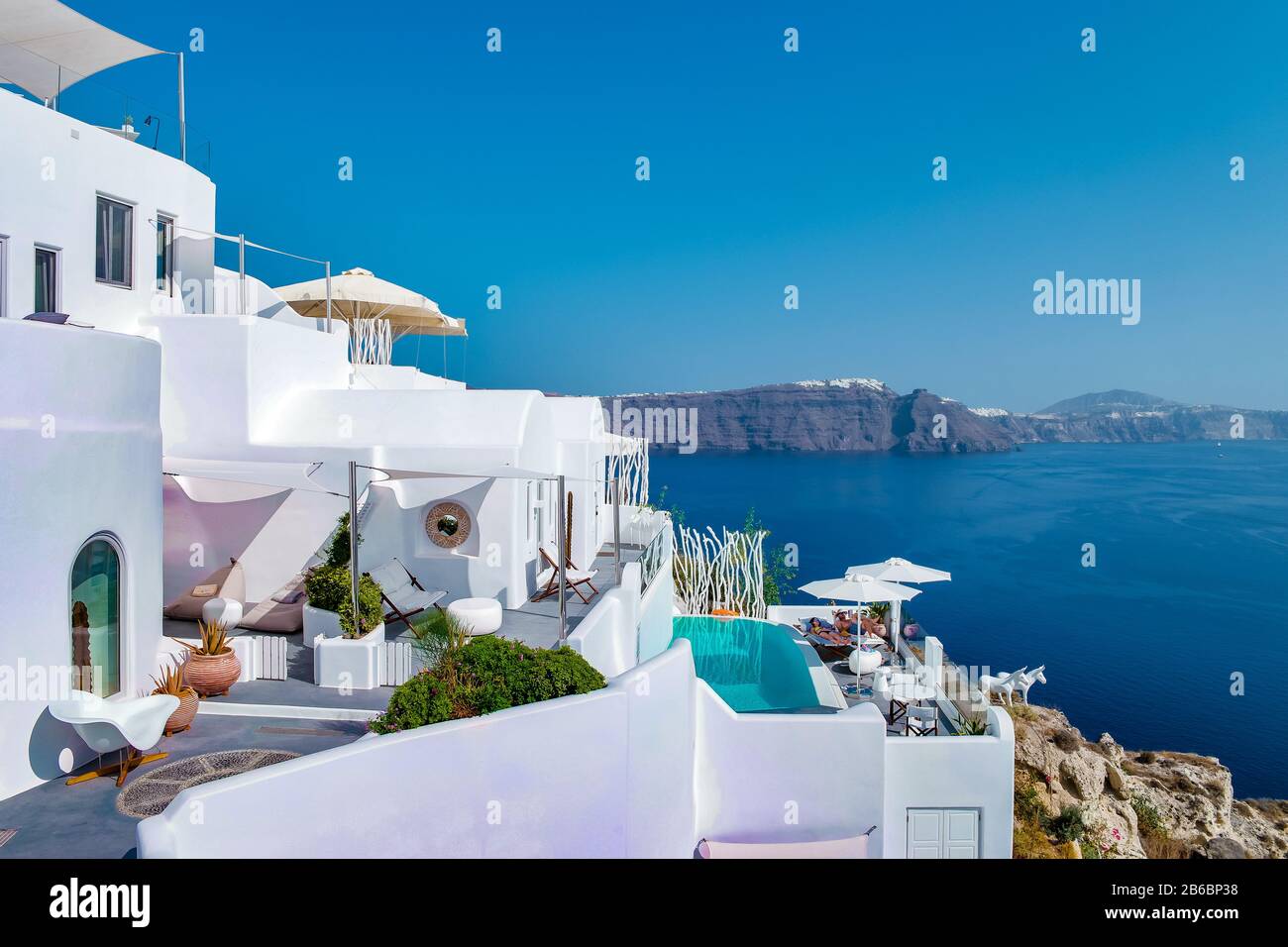 Santorini Oia village during sunset whit luxury hotels and whitewashed ...