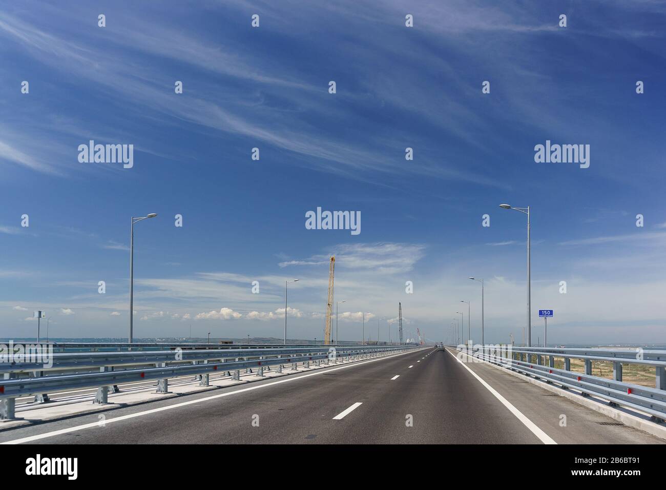 Cars driving on the Tuzla spit on the Taman Peninsula on a Sunny day ...