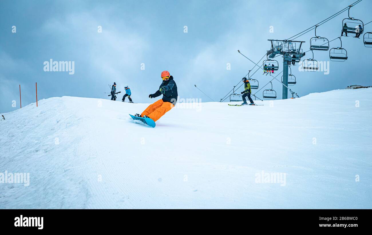 Man going down on slope hi-res stock photography and images - Alamy