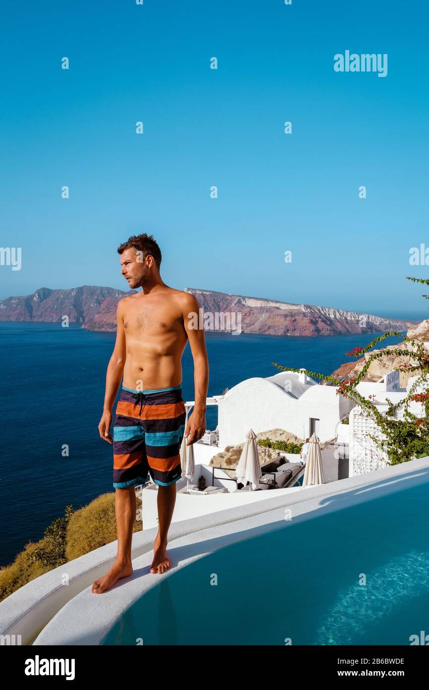 man on vacation Greece visisting Oia Santorini, guy on holiday in ...