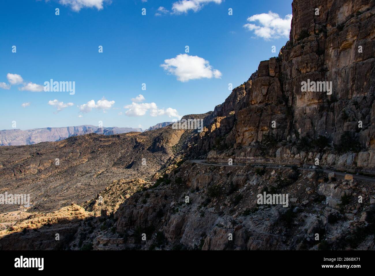 Mountain and valley view along Wadi Sahtan road in Al Hajir mountains ...