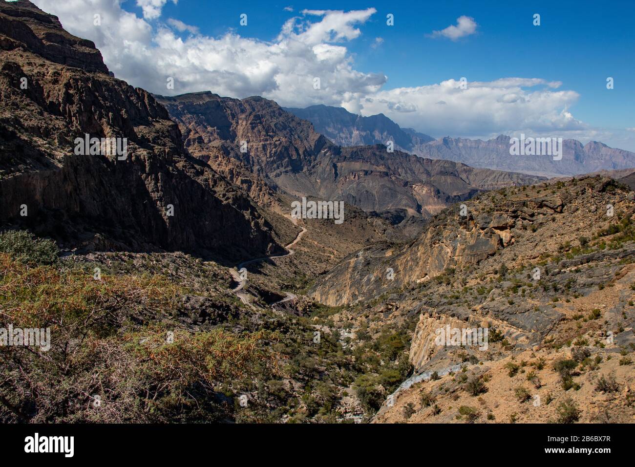 Mountain and valley view along Wadi Sahtan road in Al Hajir mountains ...