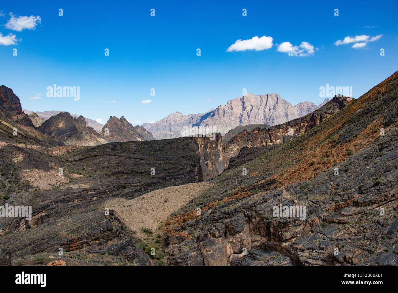 Mountain and valley view along Wadi Sahtan road and snake canyon in Al ...