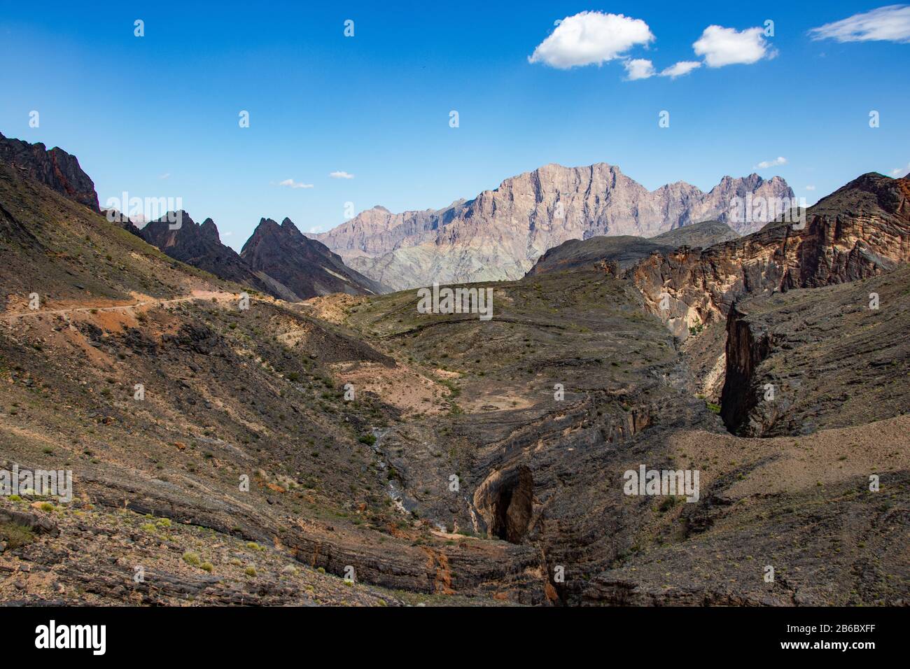 Mountain and valley view along Wadi Sahtan road and snake canyon in Al ...