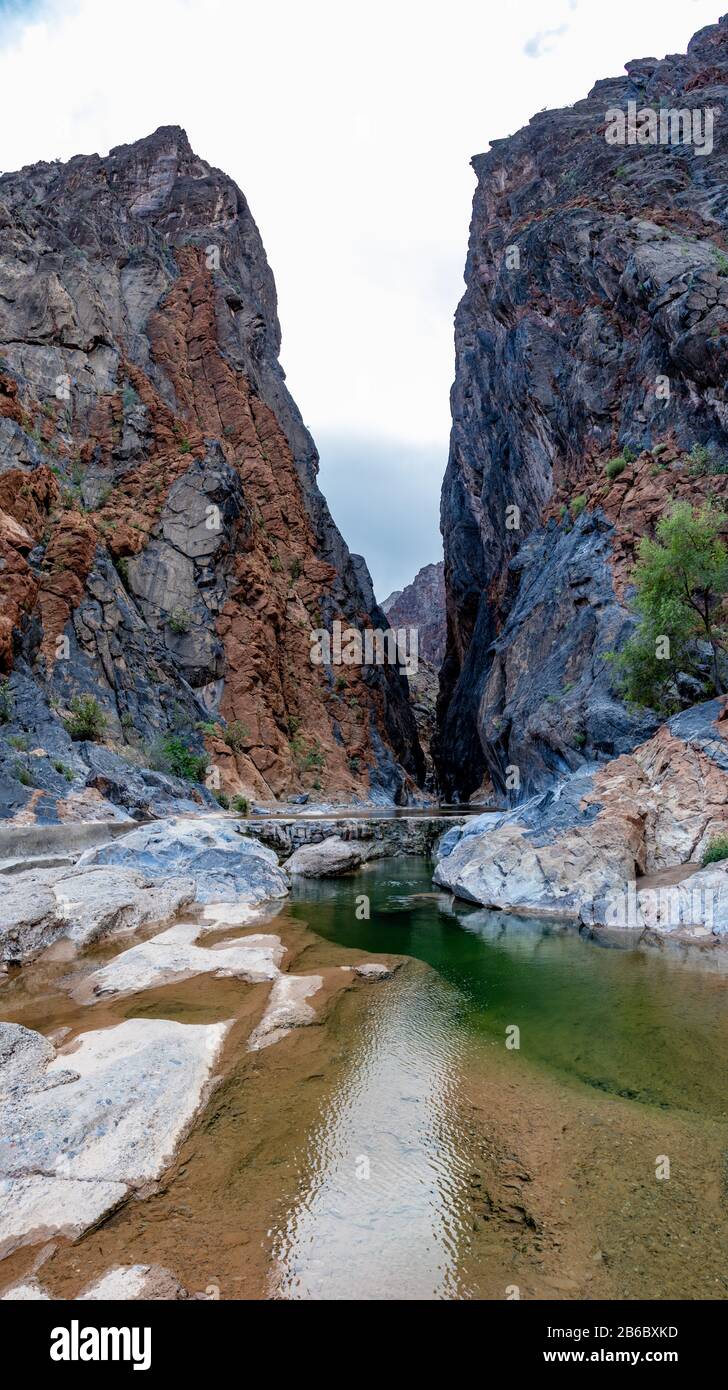 Mountain and valley view along Wadi Sahtan road and snake canyon in Al ...