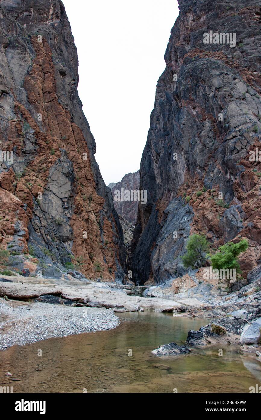 Mountain and valley view along Wadi Sahtan road and snake canyon in Al ...