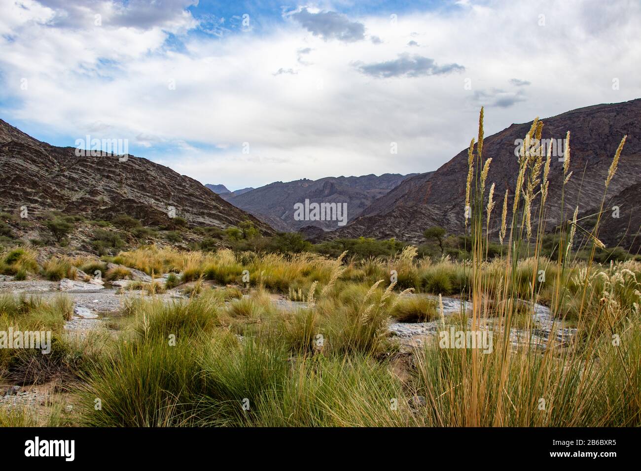 Mountain and valley view along Wadi Sahtan road and snake canyon in Al ...