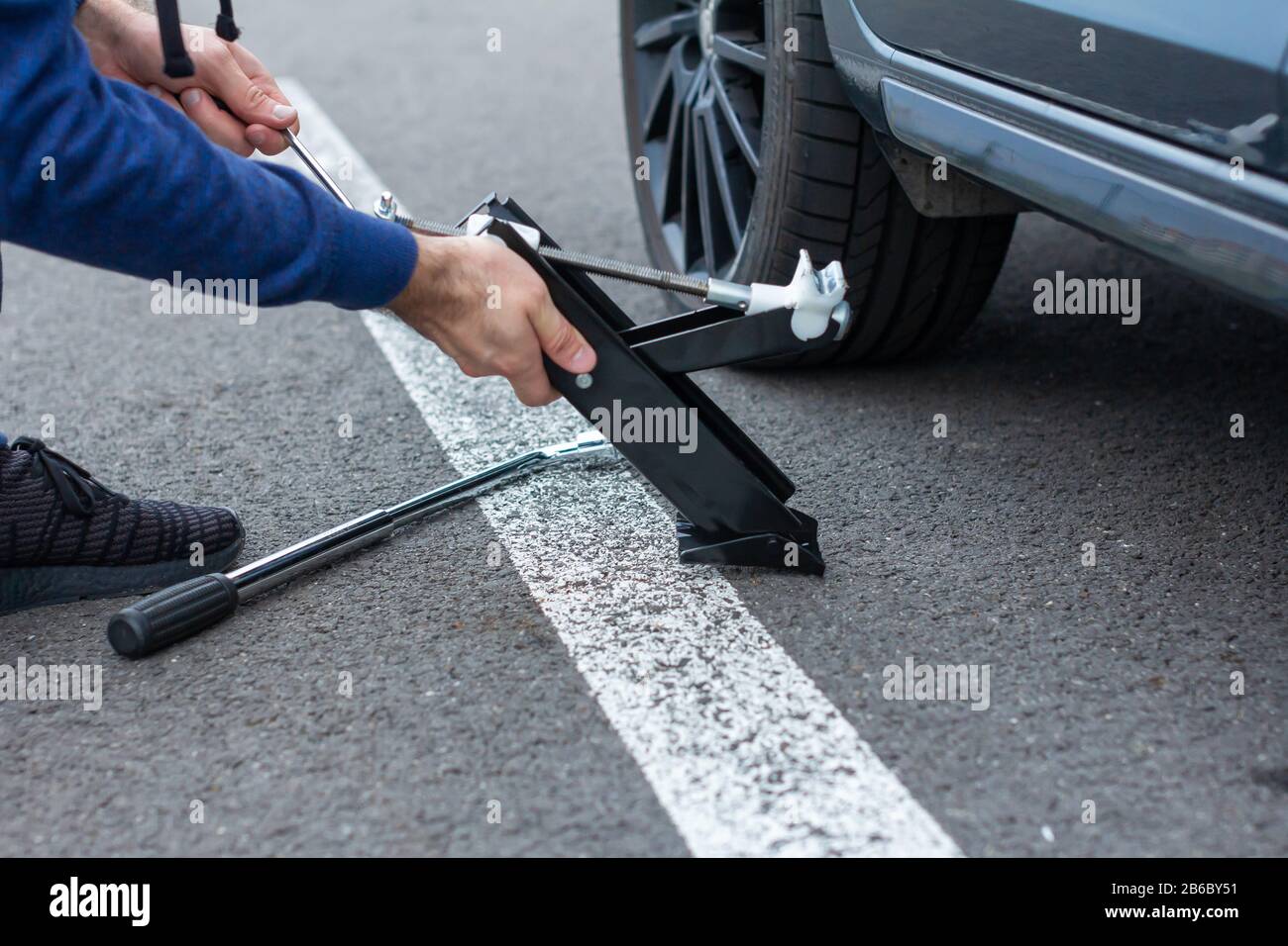 Repairman jacking hi-res stock photography and images - Alamy
