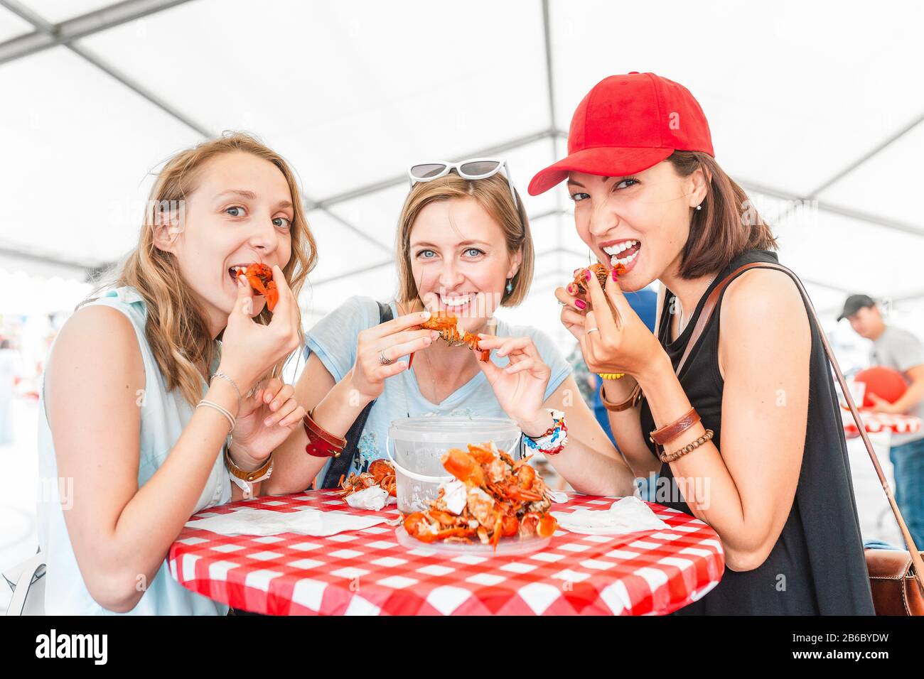 Woman eating crab hi-res stock photography and images - Alamy