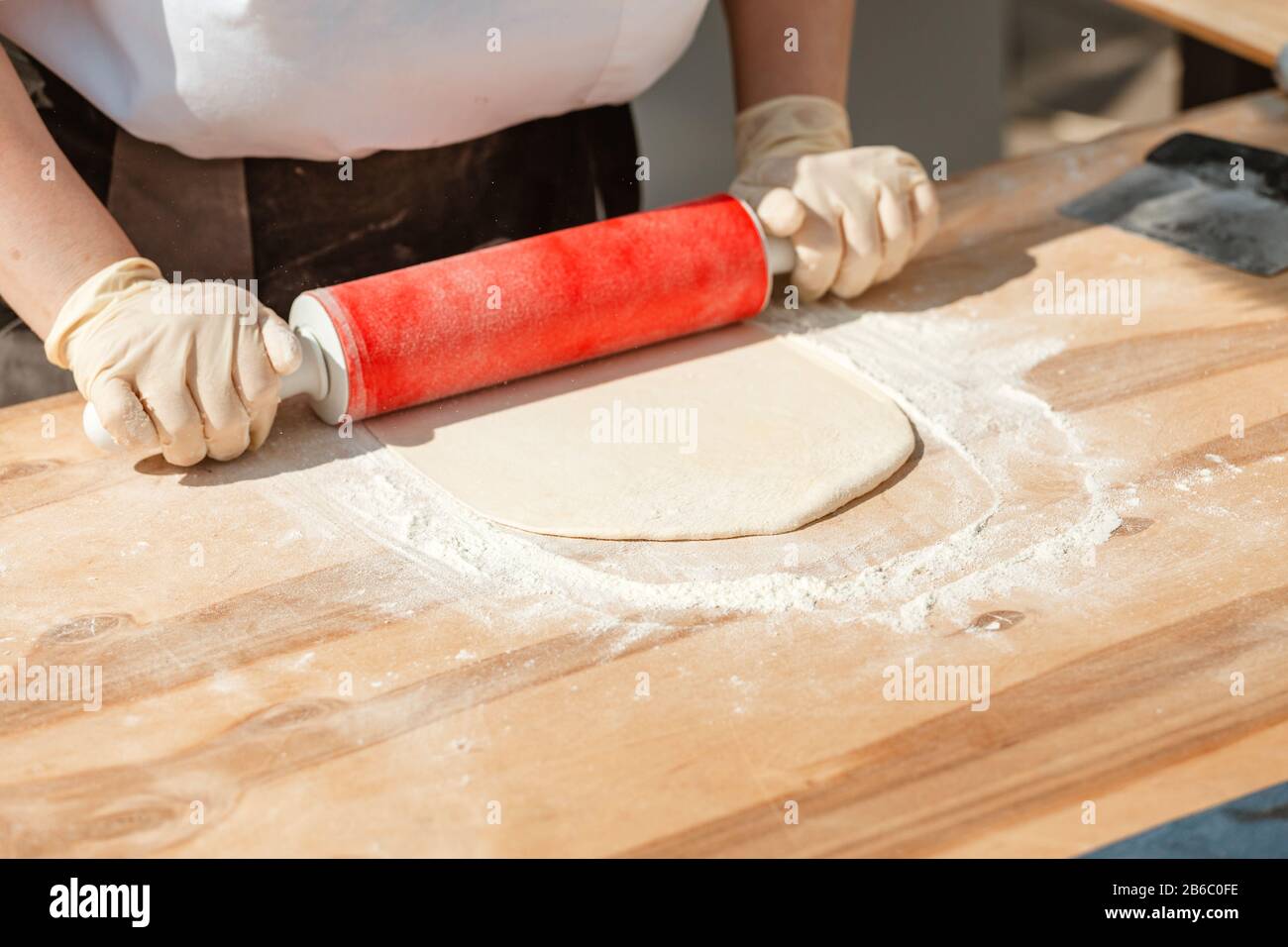 Rolling dough hands wooden roller hi-res stock photography and images ...