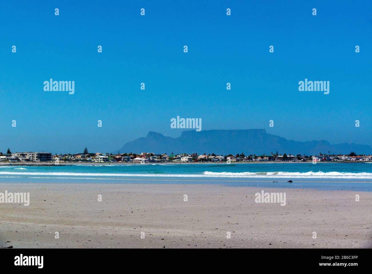 The coastal town of Melkbosstrand with Table Mountain in the background ...