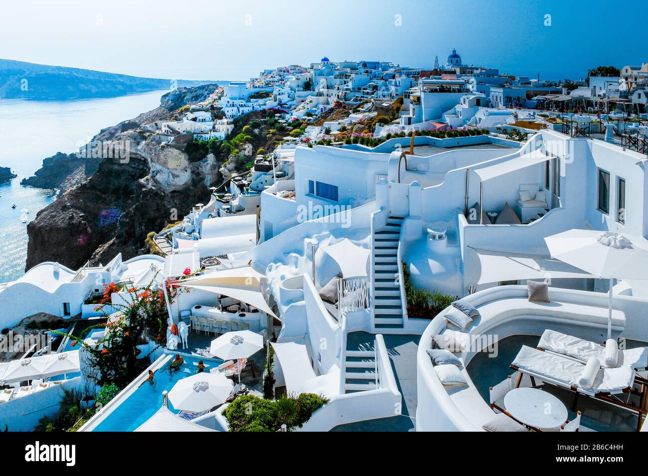 Santorini Oia village during sunset whit luxury hotels and whitewashed ...