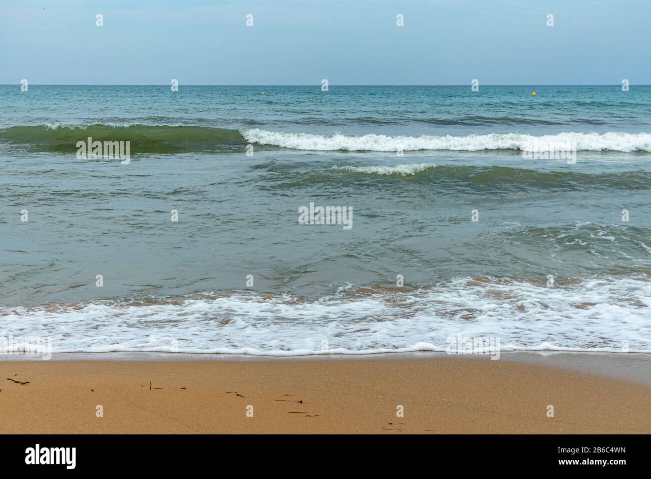 Surf on a beach in Alicante. Spain Stock Photo - Alamy
