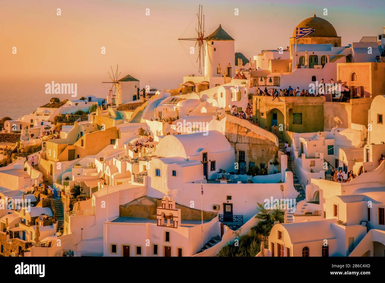 Santorini Oia village during sunset whit luxury hotels and whitewashed ...