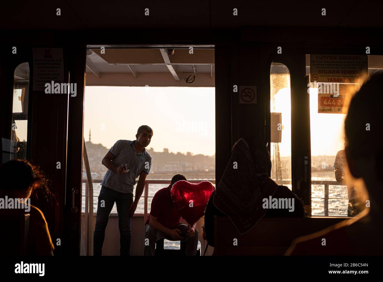 Istanbul, Turkey - 25 August 2019 : Man holding an heart shaped balloon ...