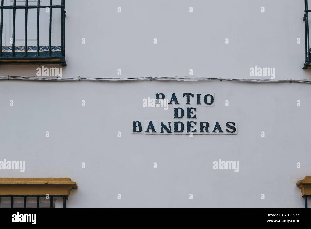 Street name sign on Patio De Banderas street in Seville, Andalusia ...