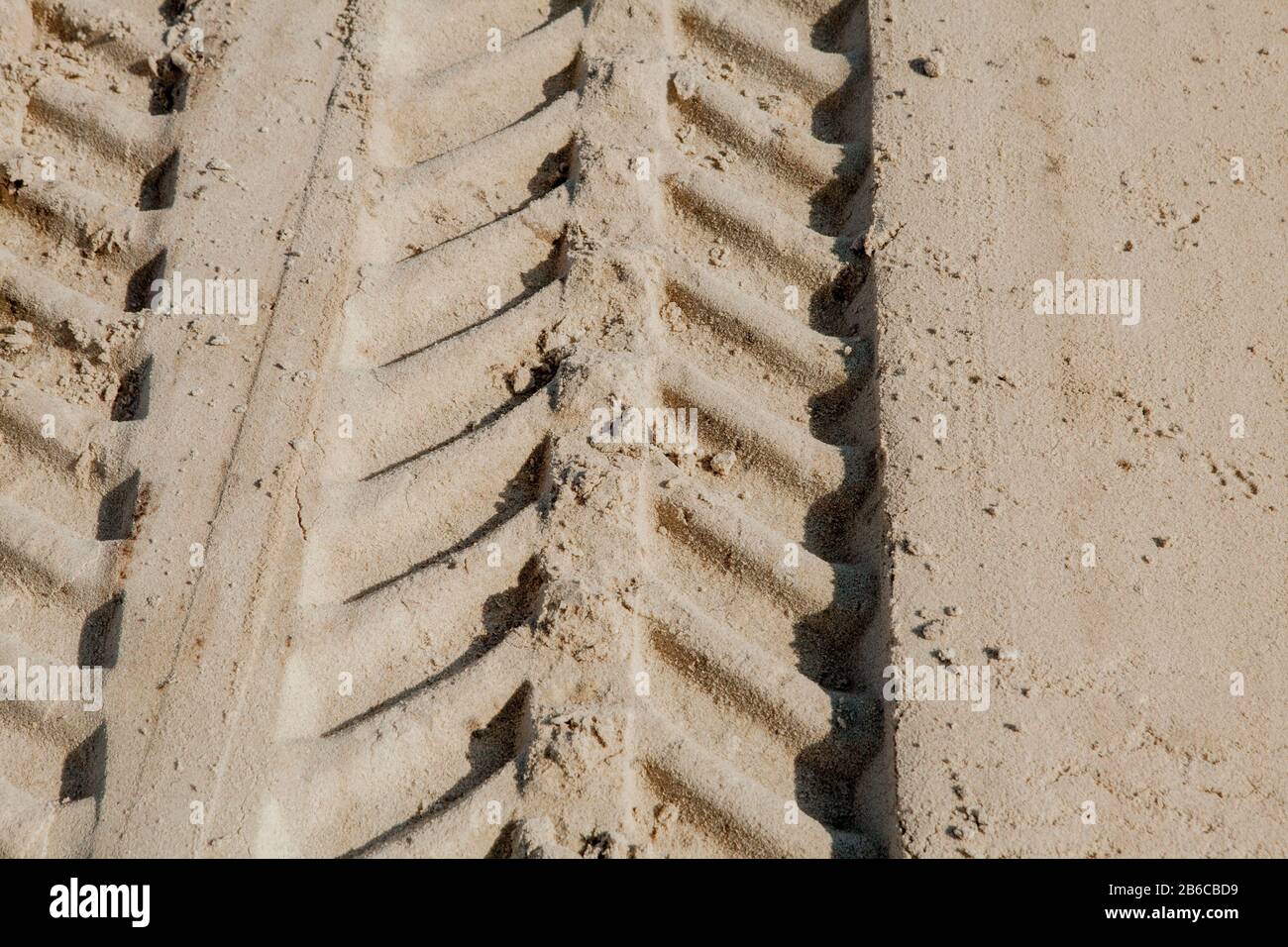 Tire tracks in the sand of a beach Stock Photo - Alamy