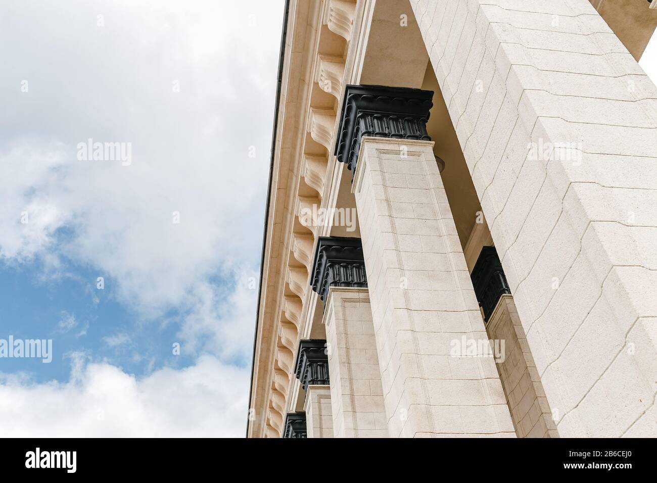 Neoclassical colonnade with white columns as part of a public building ...