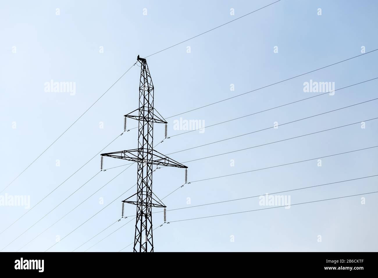 Metal high voltage power line support Stock Photo - Alamy
