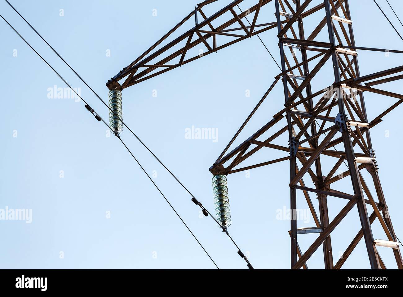 Metal high voltage power line support Stock Photo - Alamy