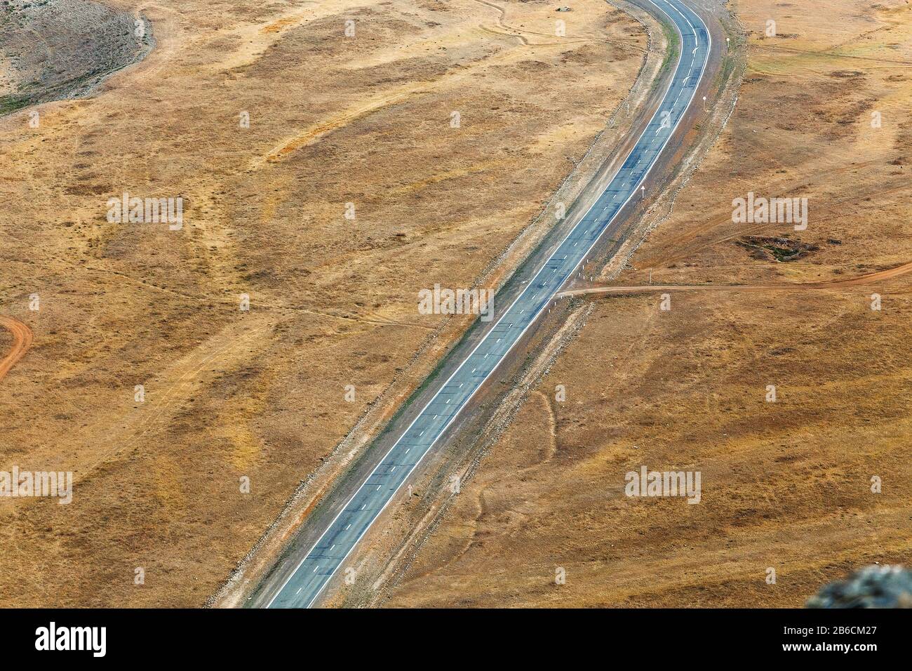 rural highway road in deserted landscape, aerial bird view Stock Photo ...