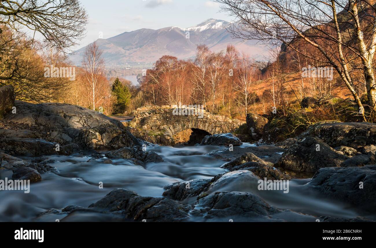 Fast moving water flows over rocks and boulders on Barrow Beck as it ...
