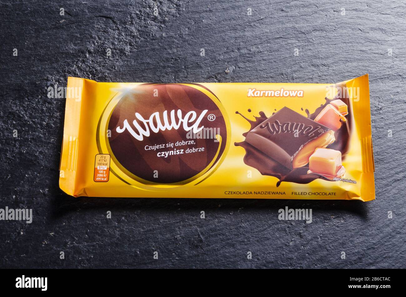 Wawel chocolate bar on stone background. Wawel is polish confectionery ...