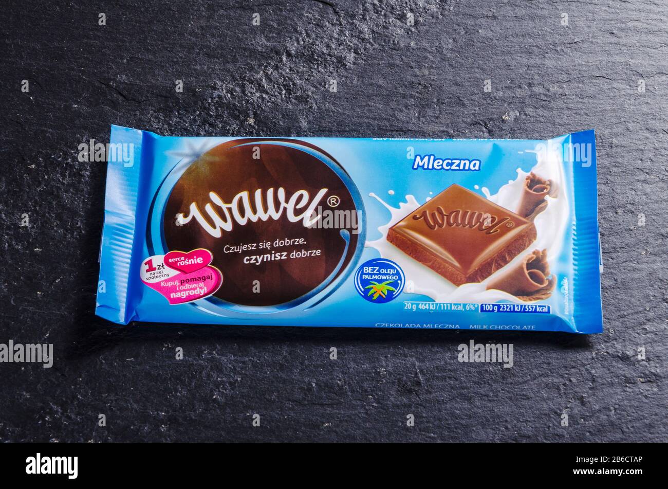 Wawel chocolate bar on stone background. Wawel is polish confectionery ...
