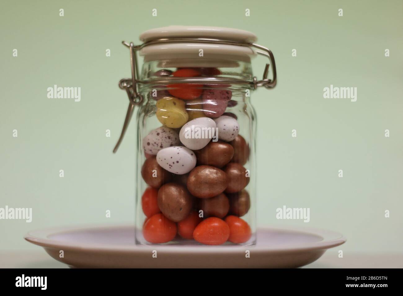 Glass jar full of mini chocolate easter eggs. 09/03/2020. droitwich ...
