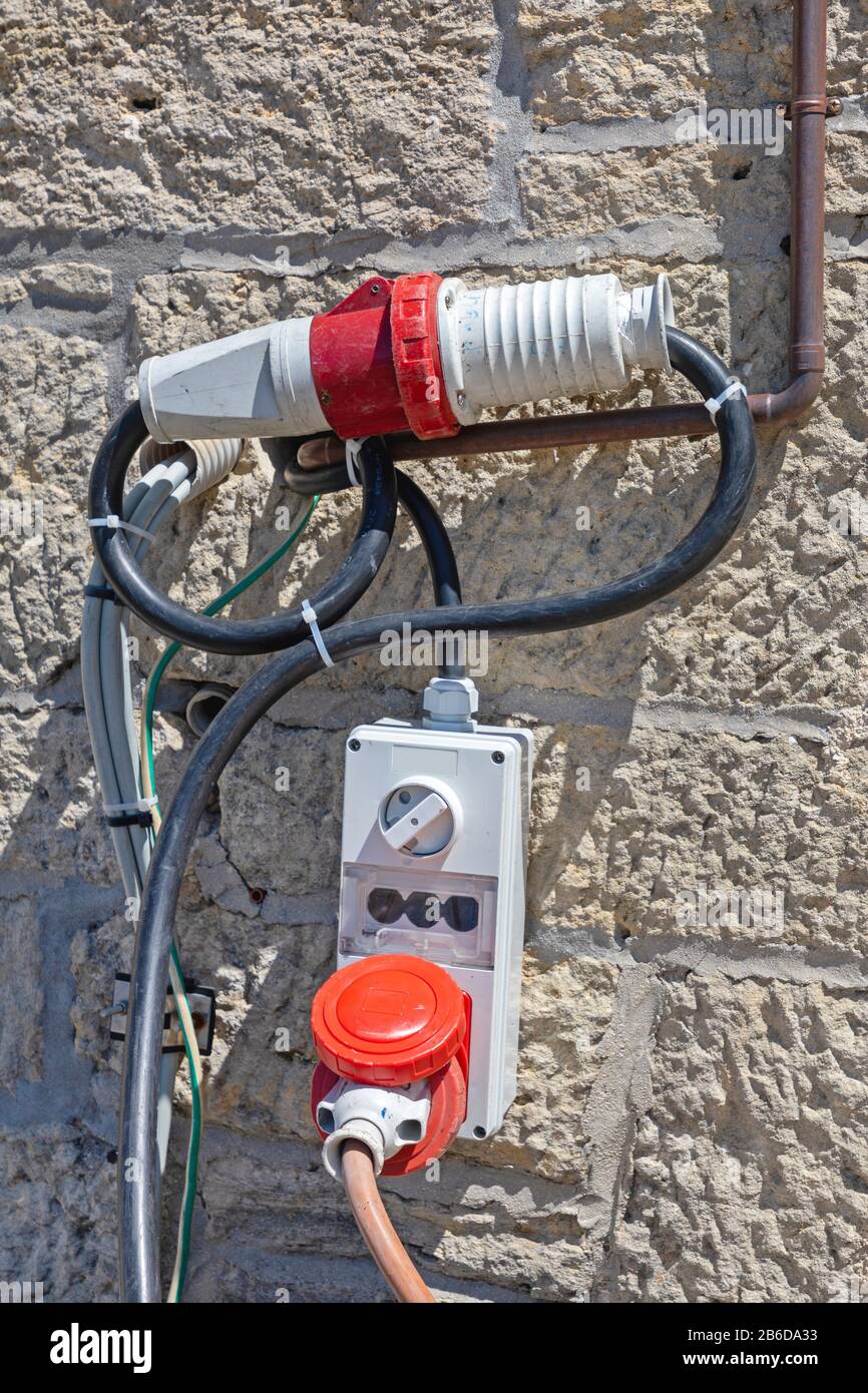 Electric Power Cables and Wires at Exterior Wall Stock Photo - Alamy