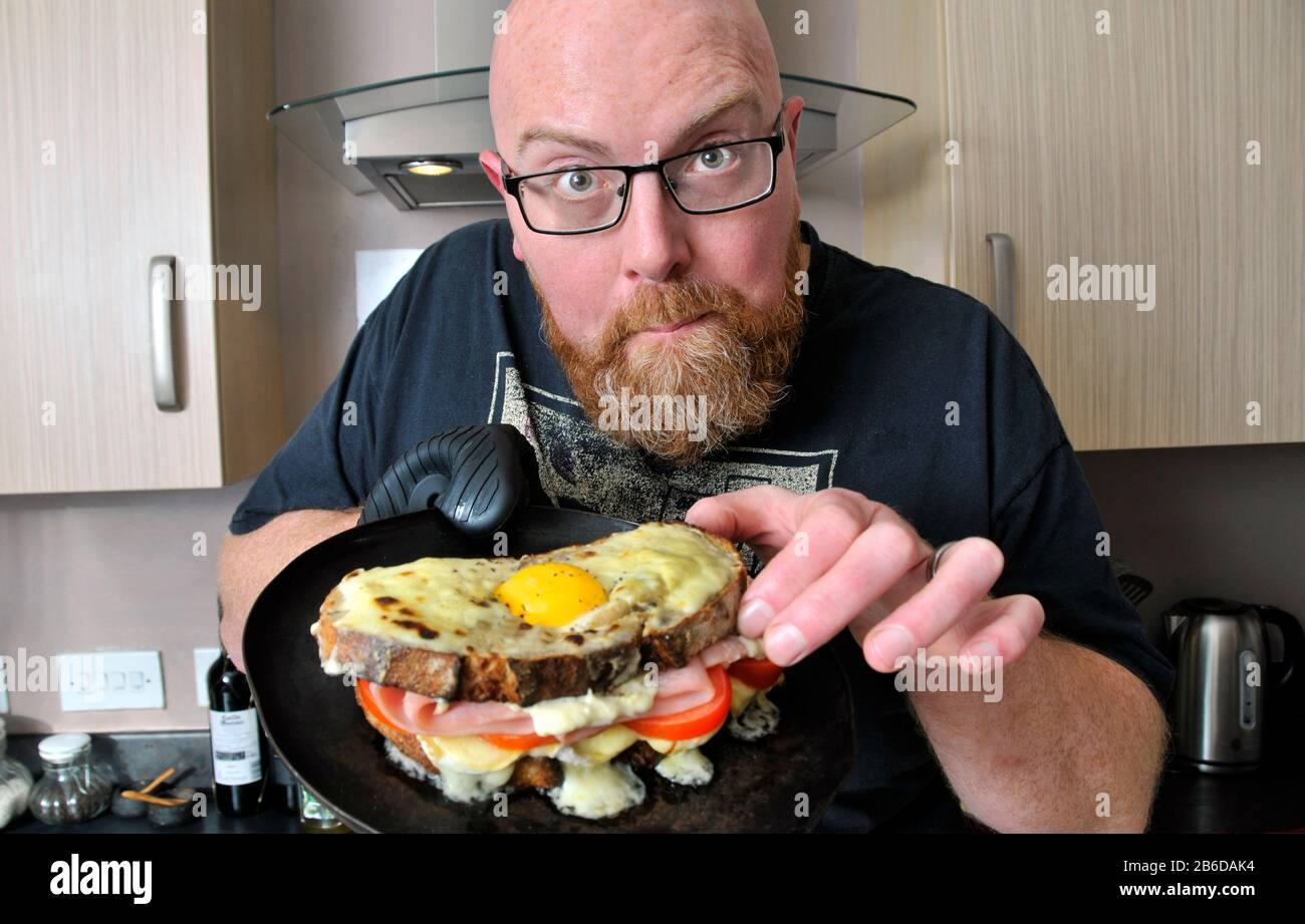 Man with sandwich Stock Photo - Alamy