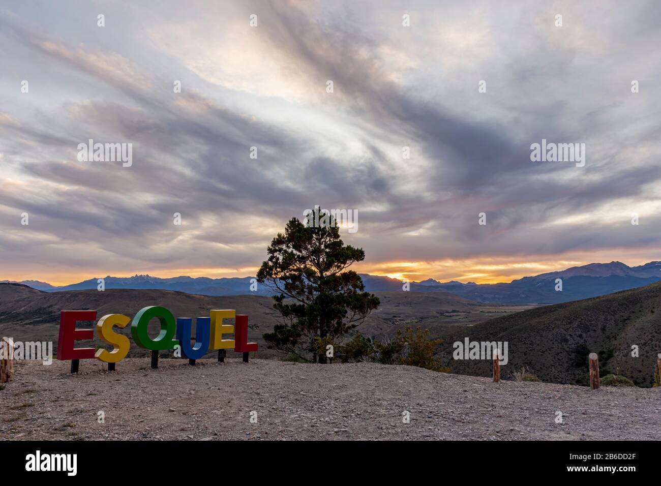 Landscape view of Esquel city name sign against Andes mountains beneath ...