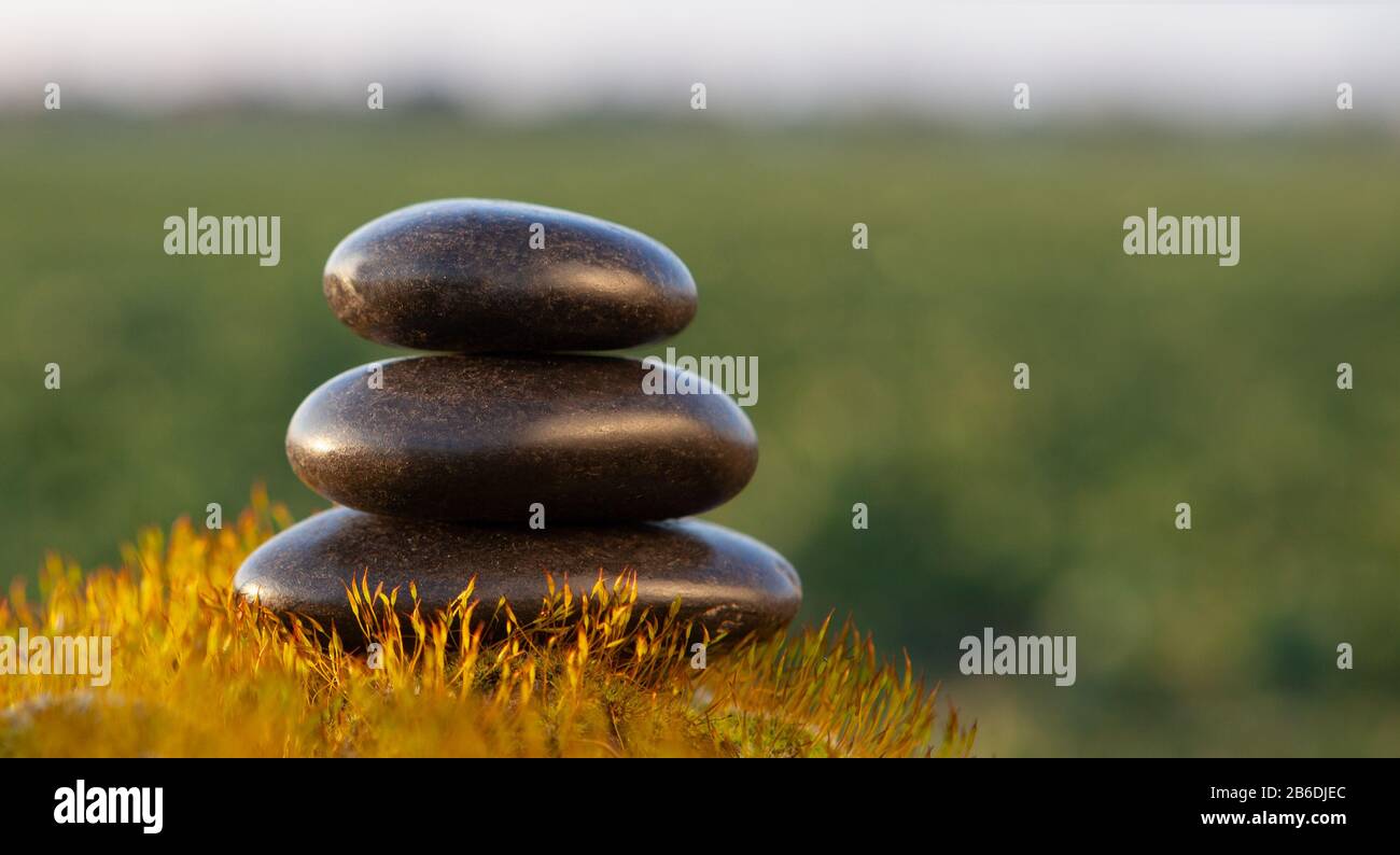 Stack of zen stones on nature background Stock Photo - Alamy