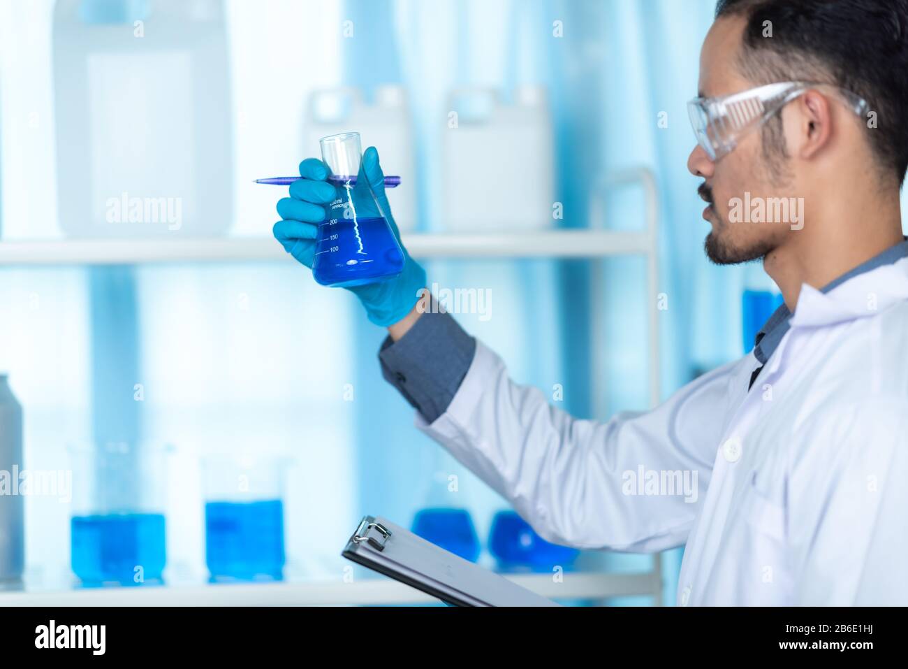 In a Modern Laboratory Research Scientist Conducts Experiments by ...