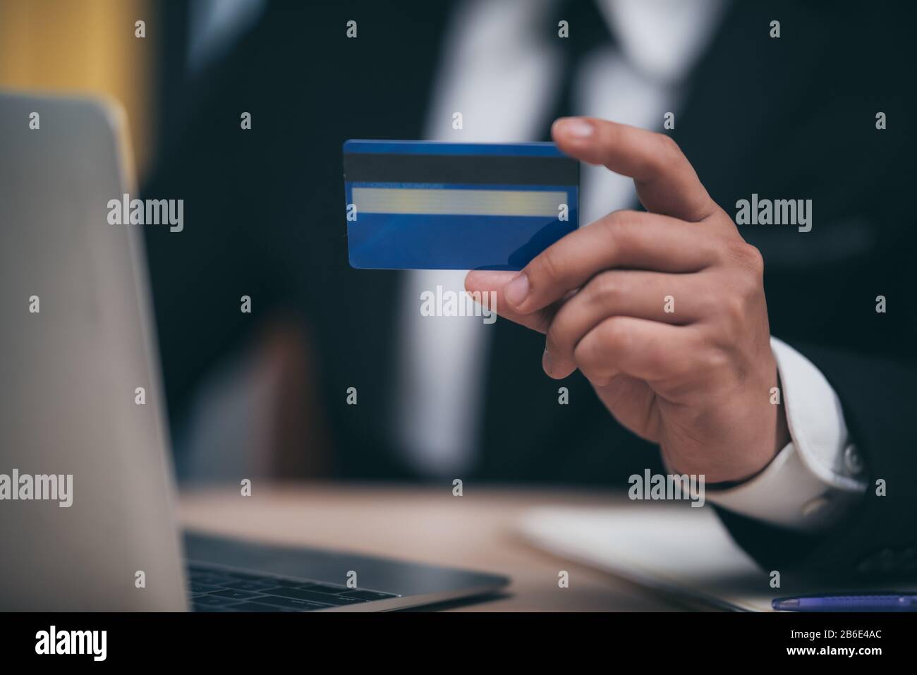 Business people use credit cards to do financial transactions at work ...