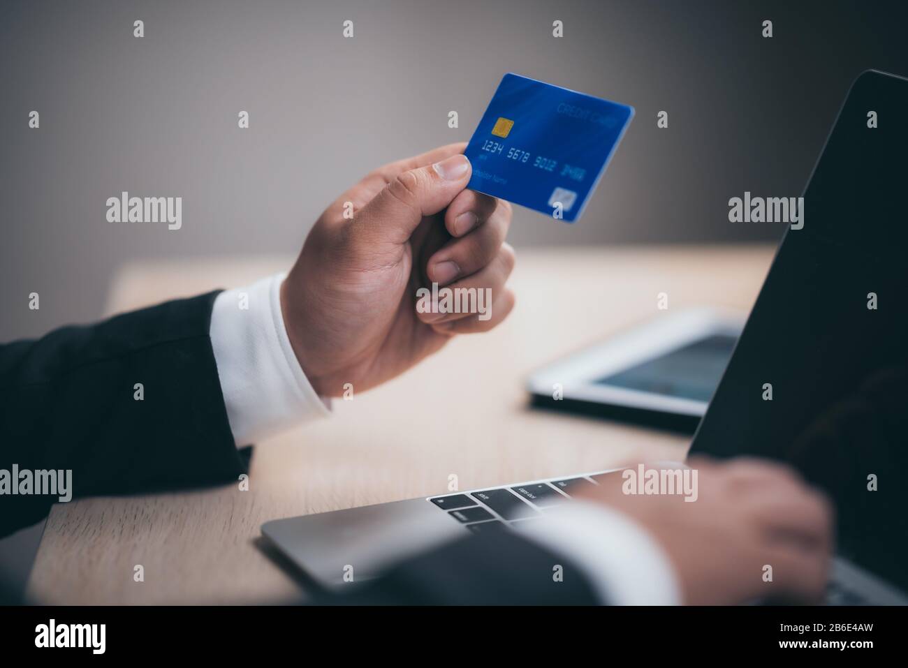 Business people use credit cards to do financial transactions at work ...